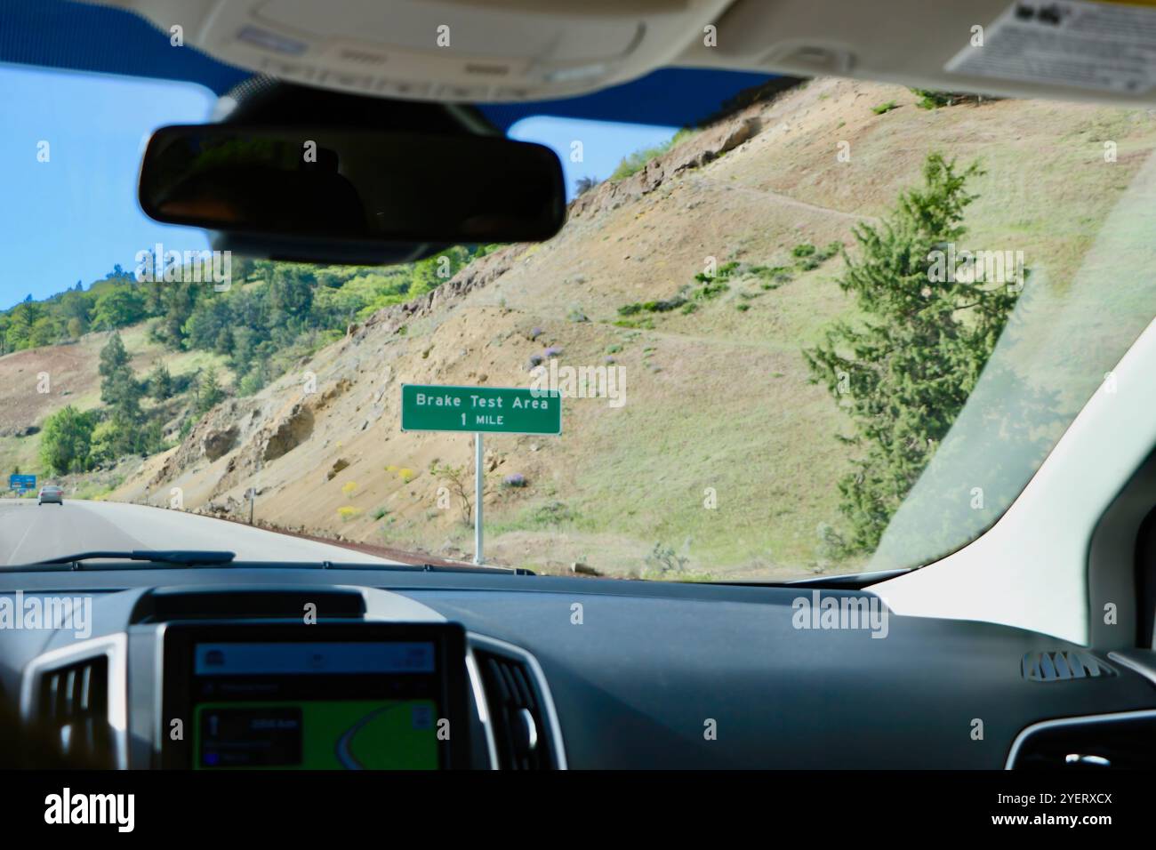 View from inside a car driving north on Interstate 5 with a sign Brake ...