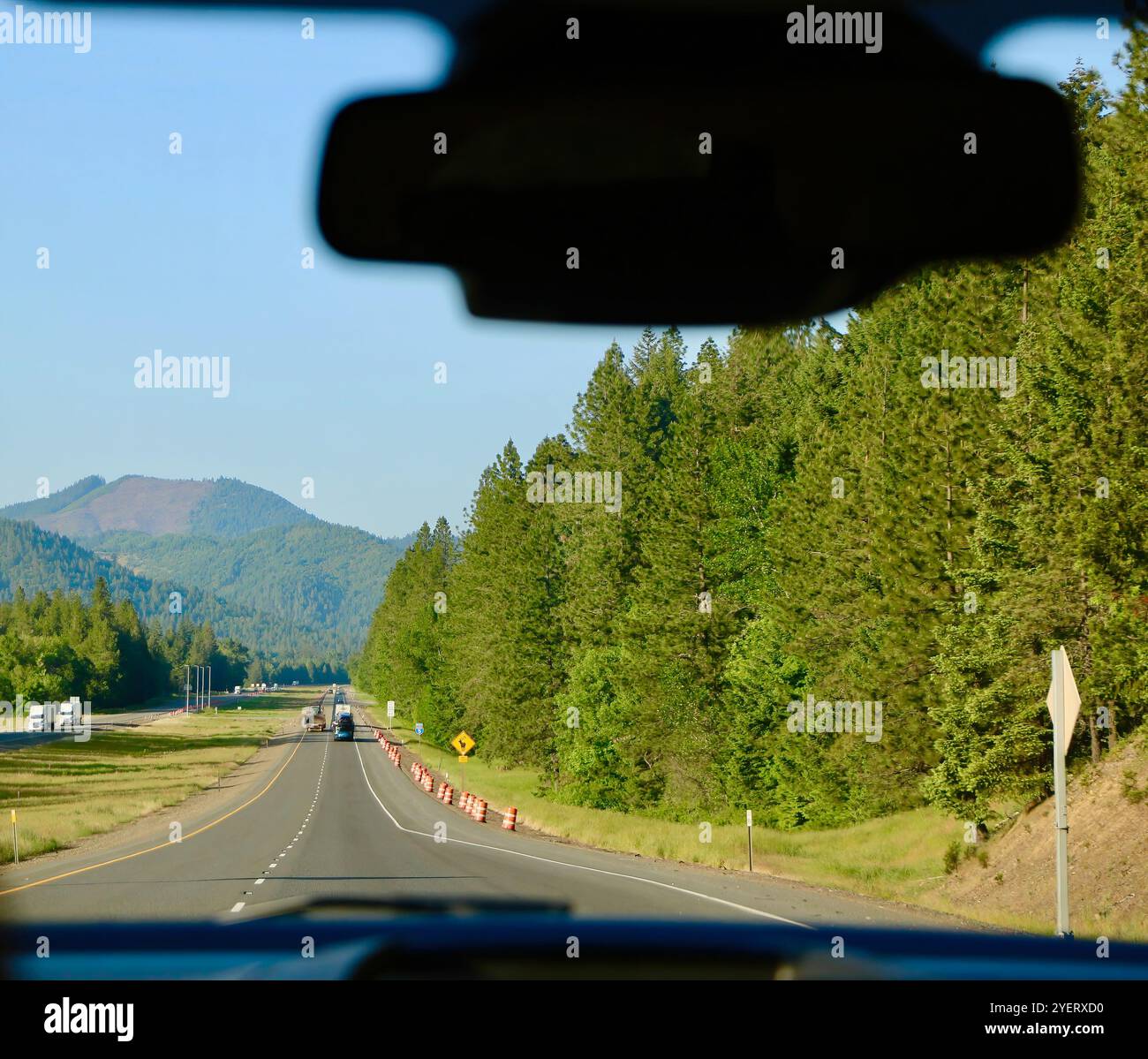 View from inside a car driving north on Interstate 5 with traffic cones ...