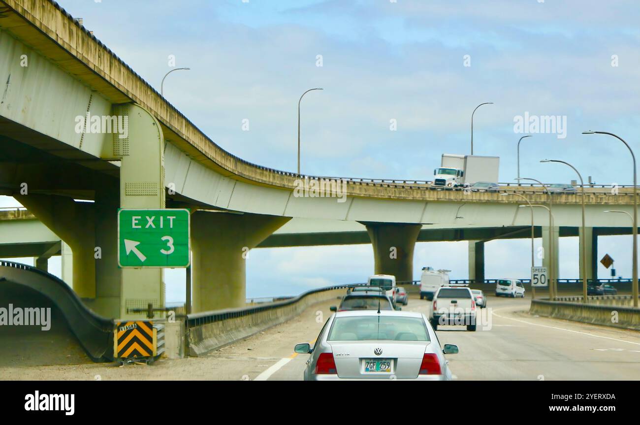 View from inside a car driving north on Interstate 5 with concrete ...