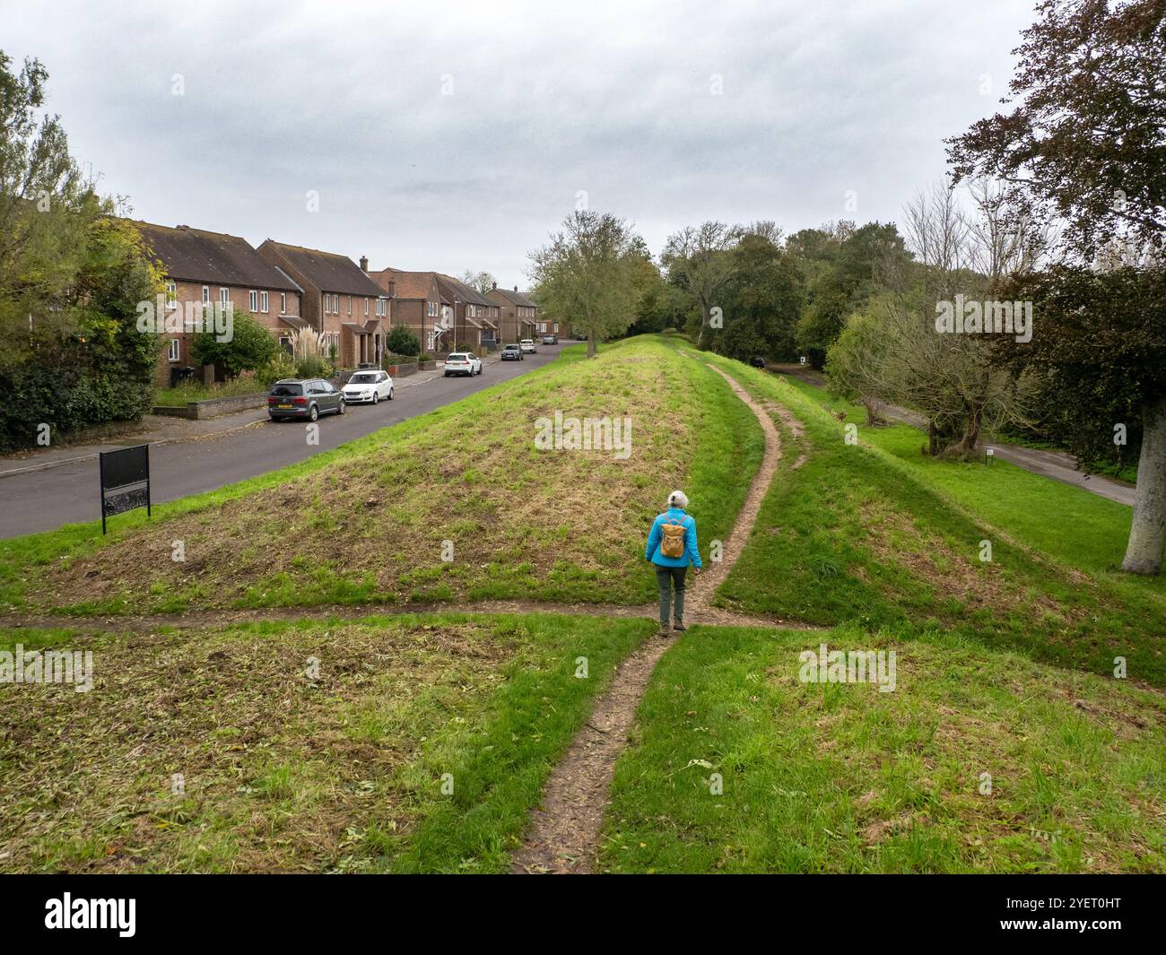 A women walking along the Saxon town walls in Wareham, Dorset, built to ...