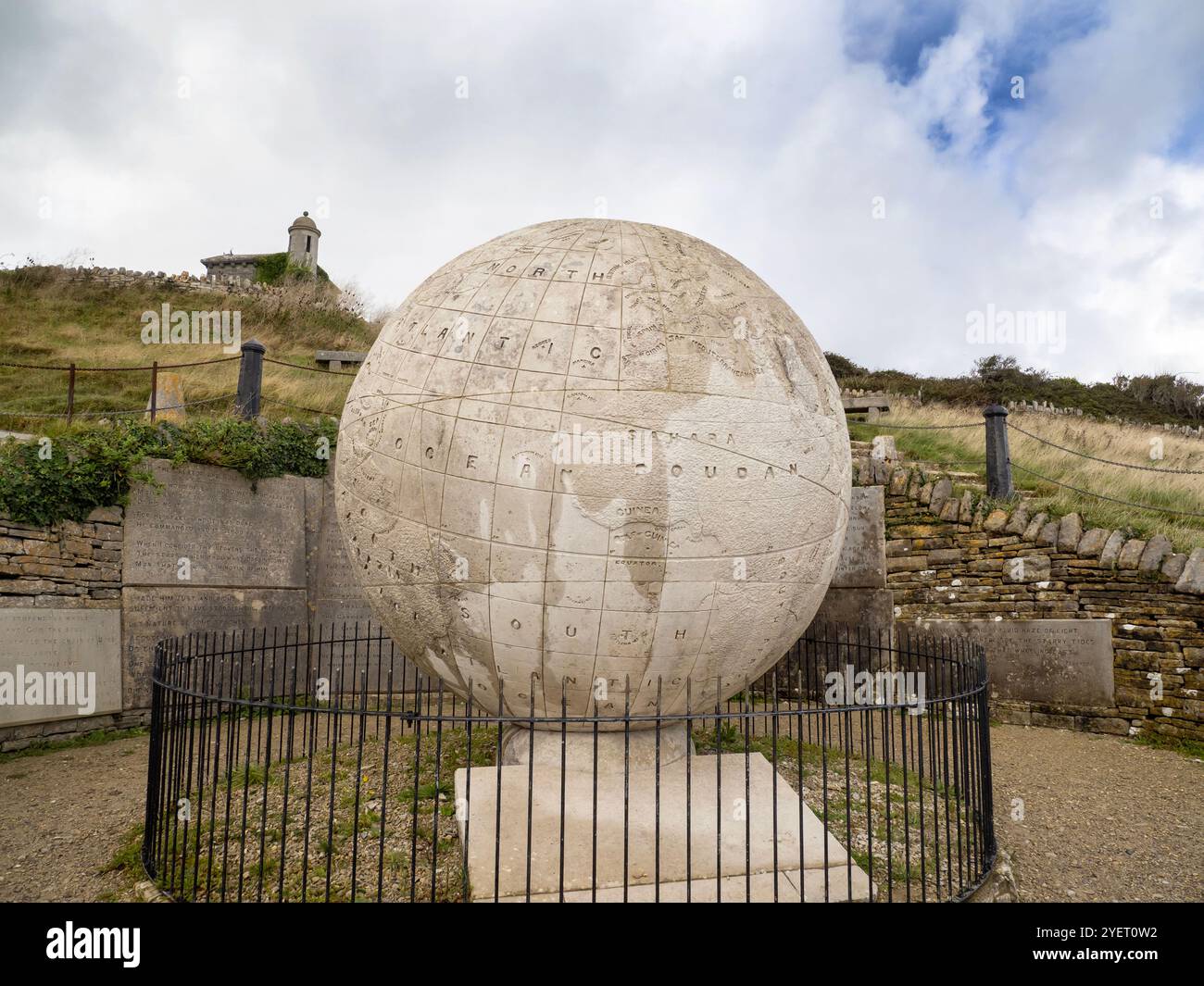 A limestone rock globe carved in the grounds of Durlston country park ...