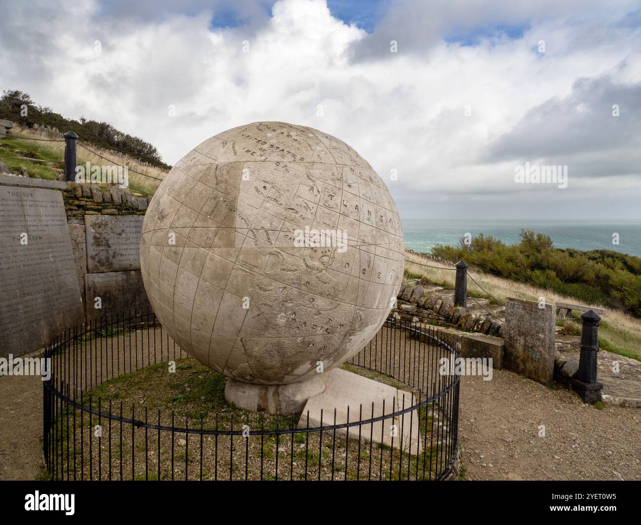 A limestone rock globe carved in the grounds of Durlston country park ...