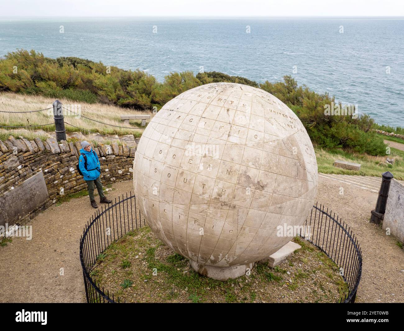 A limestone rock globe carved in the grounds of Durlston country park ...