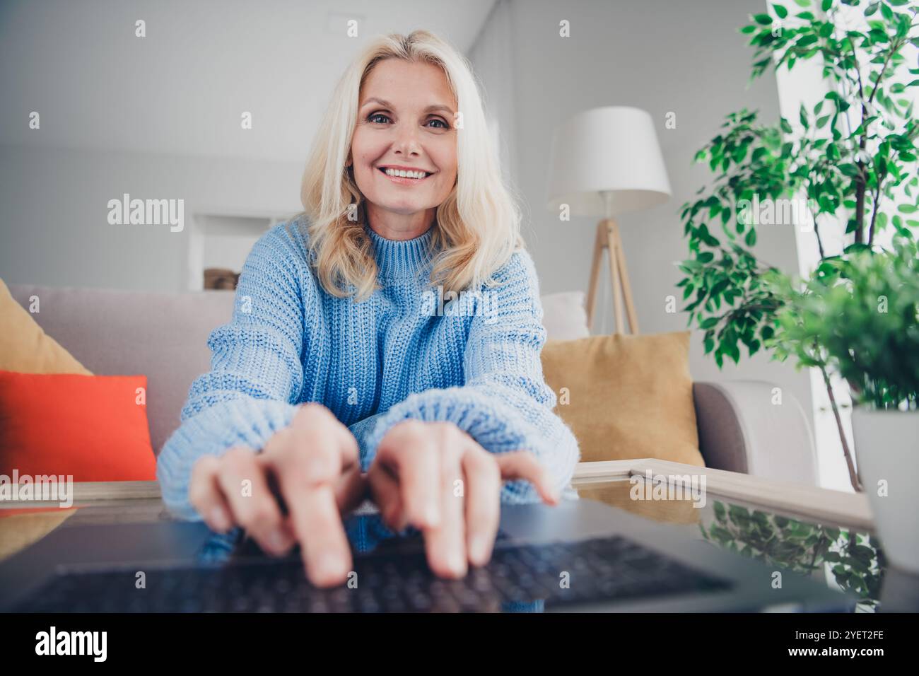 Portrait of nice aged lady write typing laptop keyboard wear sweater ...