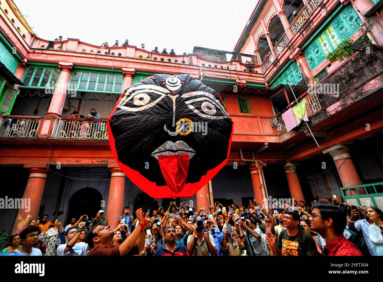 Kolkata, India. 31st Oct, 2024. People release a paper lantern during ...