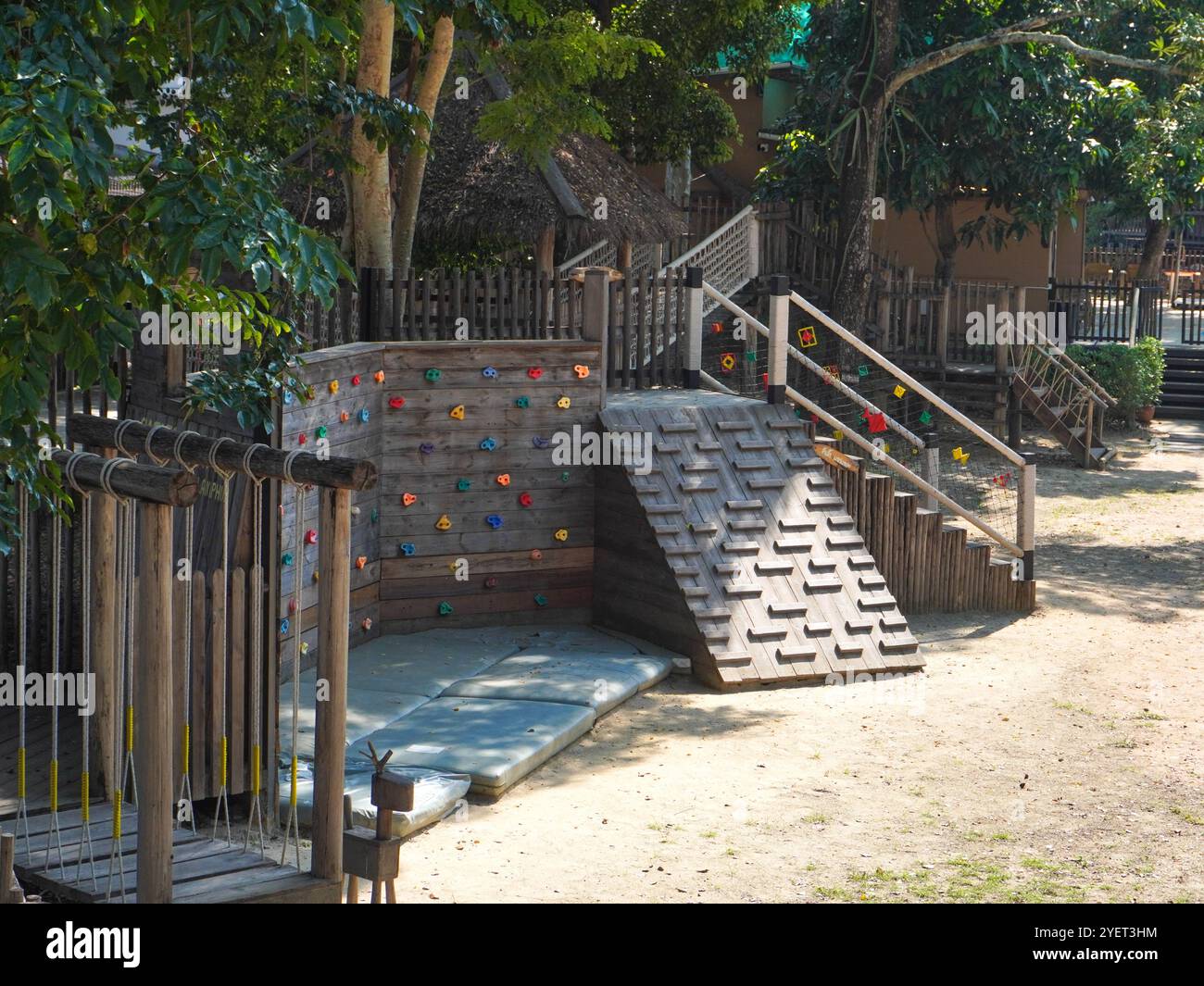 Summer park playground with swings, slides and climbing equipment ...