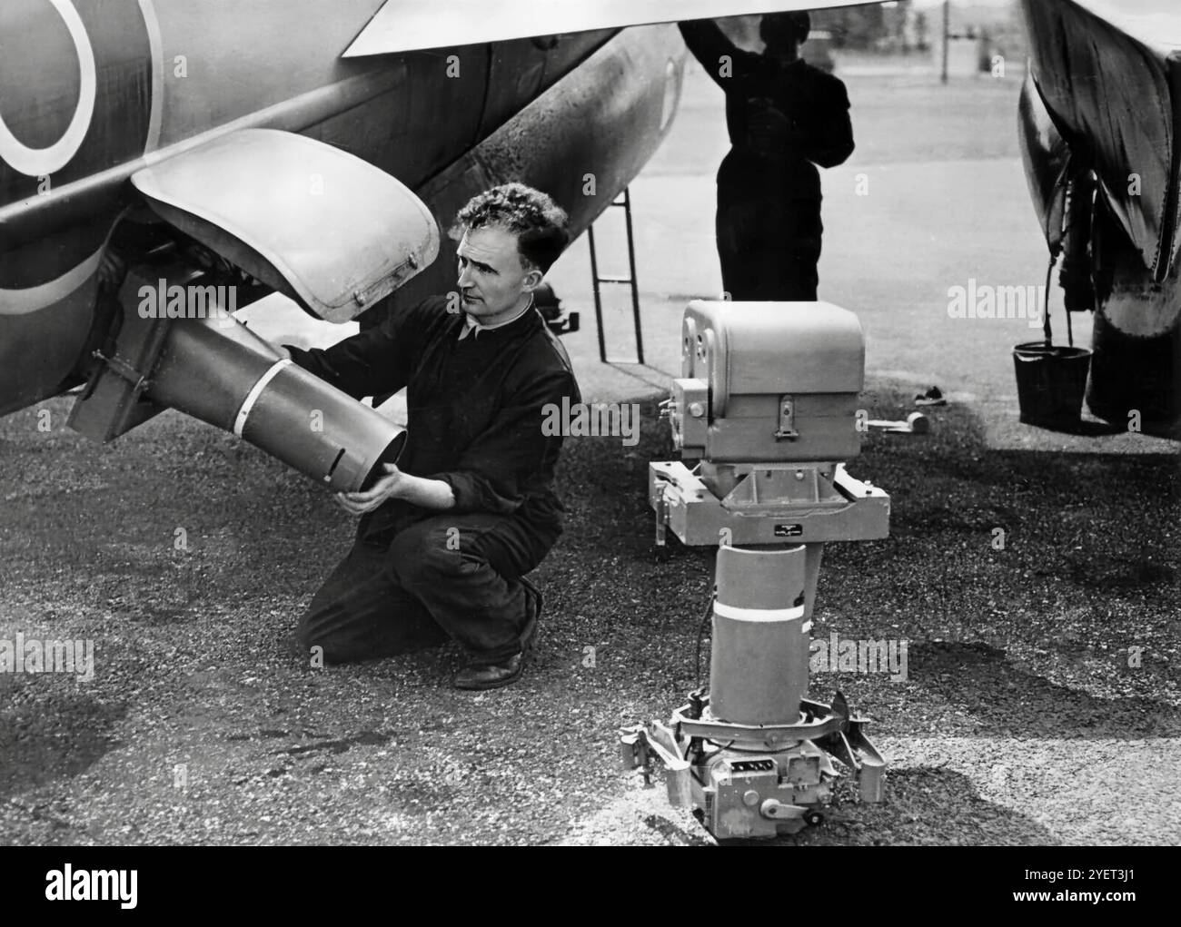Ground crew installing F.52 vertical cameras with 20-inch lens ...