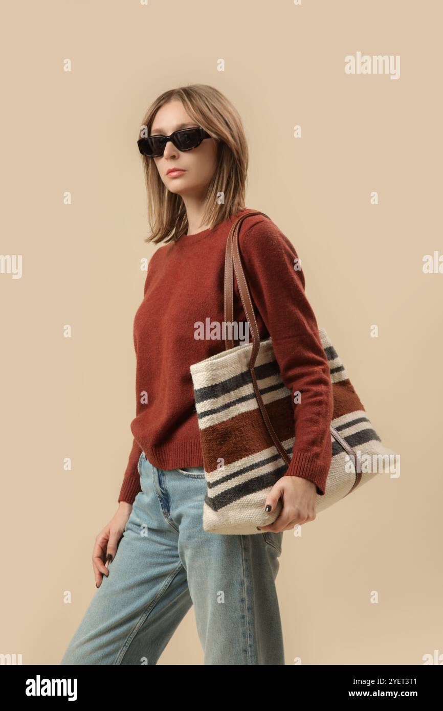 Woman in burgundy outfit hi-res stock photography and images - Alamy