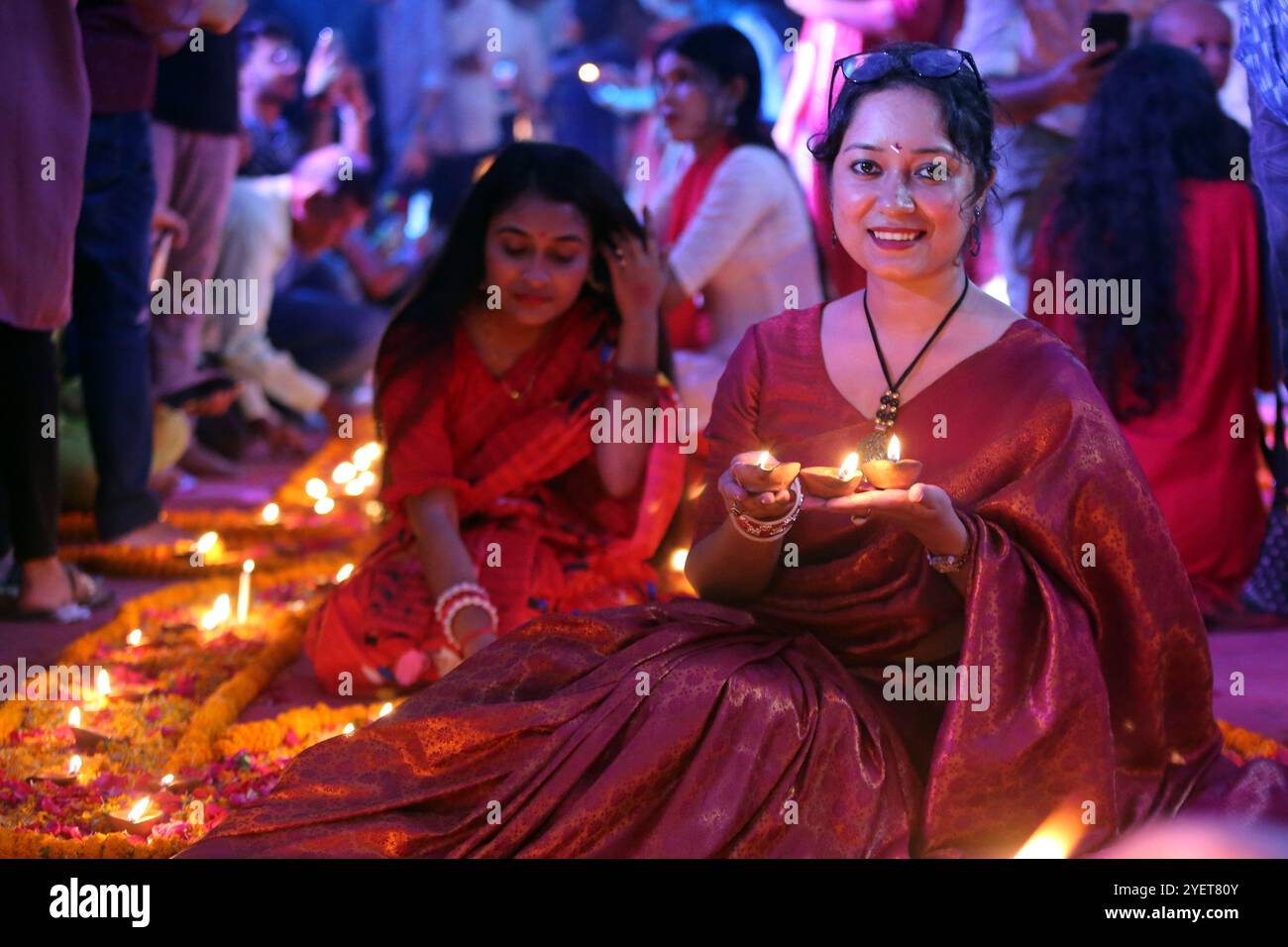 Dhaka. 1st Nov, 2024. People light oil lamps to celebrate the annual festival of lights Diwali ...