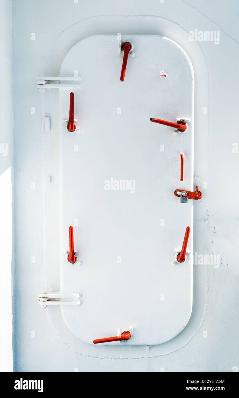 White watertight ship door with red door handles Stock Photo - Alamy