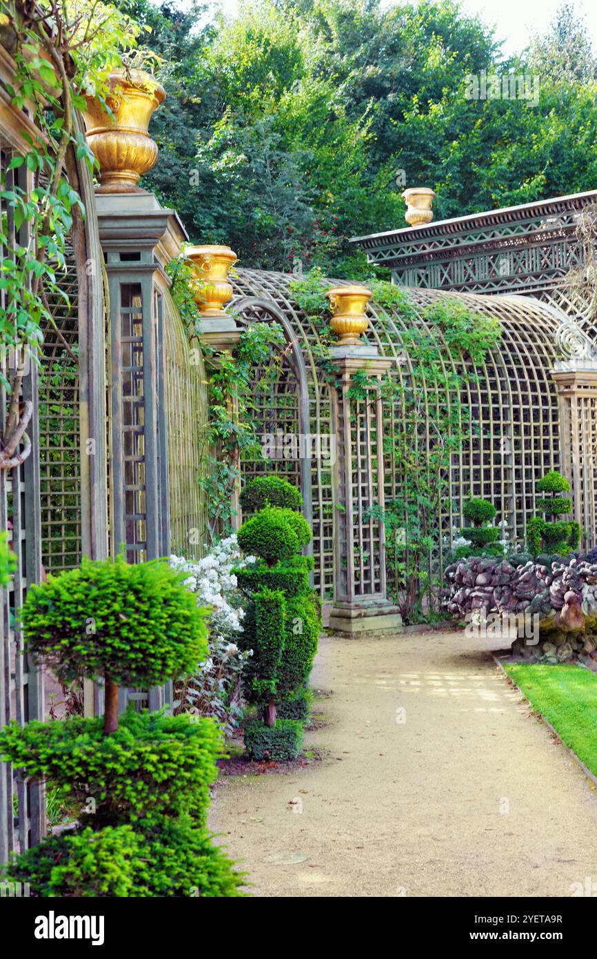 VERSAILLES FRANCE - SEPTEMBER 21 Green archway in a garden Chateau de ...