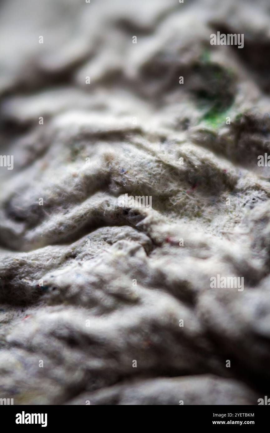 Extreme close up of old gray handmade paper clay with a structure and ...