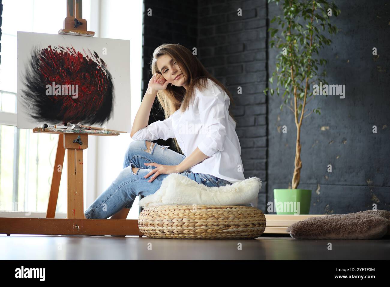 Beautiful girl artist at work in a creative white studio Stock Photo ...