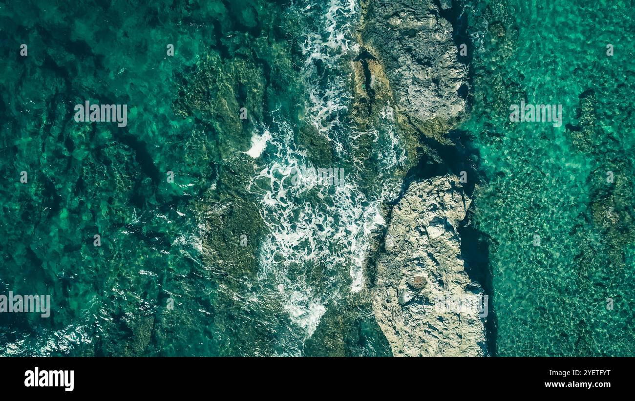 Top down aerial view of the shallow turquoise transparent water with ...