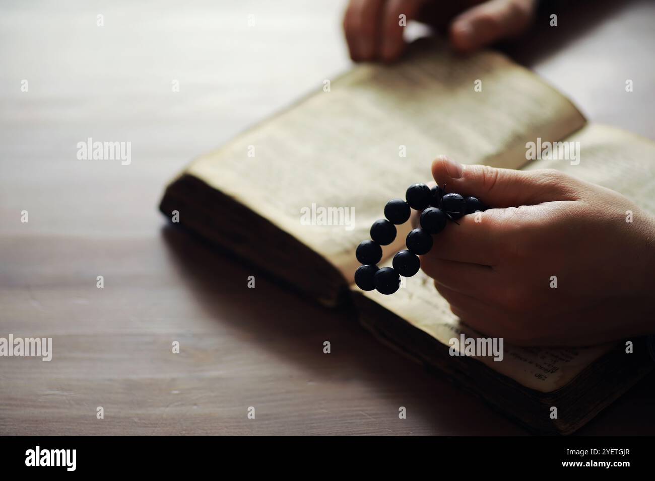 Reading religious literature. Open book. Man reads bible Koran Stock ...
