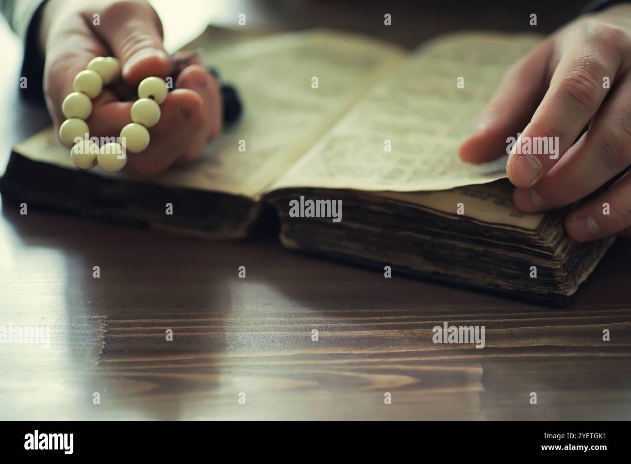 Reading religious literature. Open book. Man reads bible Koran Stock ...