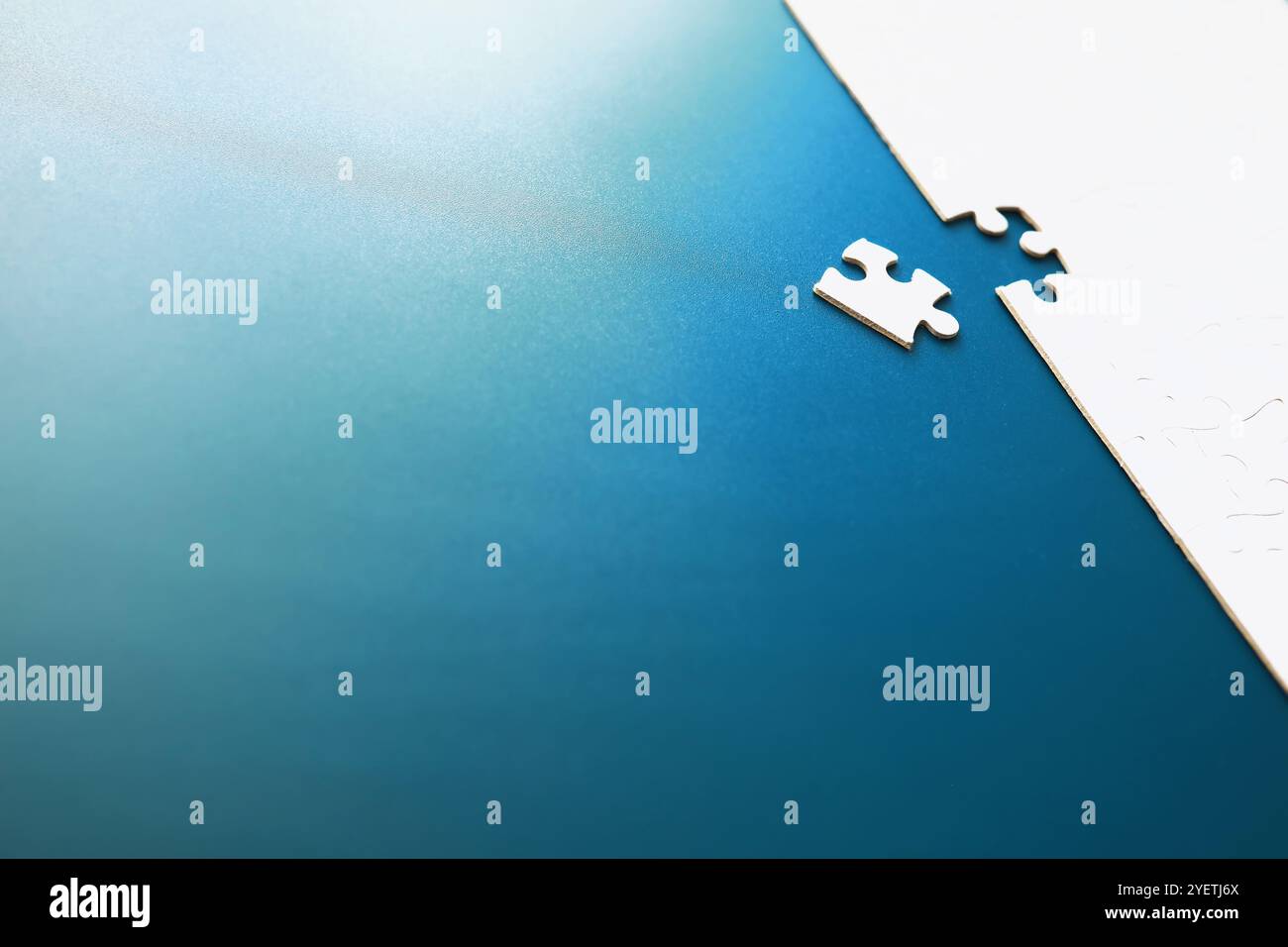 Intellectual puzzles. The puzzle empty. The hand puts together puzzle ...