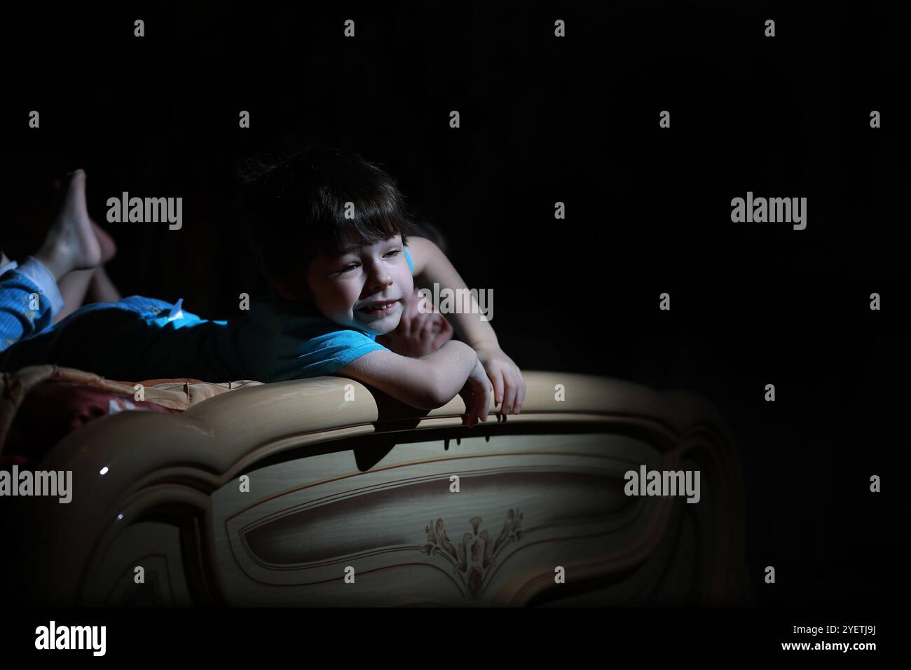 Small children in a dark room watching TV at night Stock Photo - Alamy