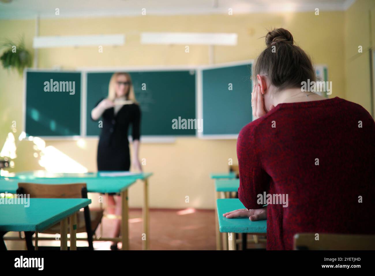 Young teacher in the school room during class Stock Photo - Alamy