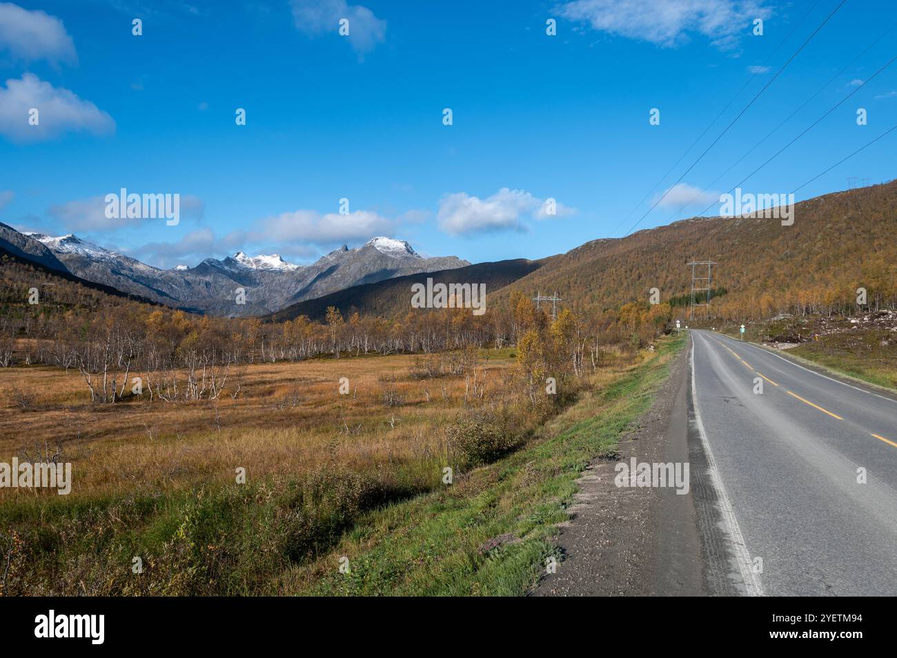 An autumn scene of the snow-capped mountain range near the main highway ...