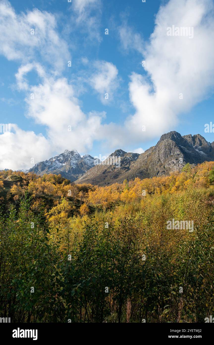 An autumn scene of the snow-capped mountain range near the main highway ...