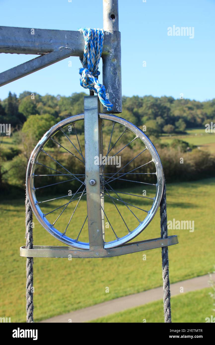 Round pulley with rope for lifting a load on a construction site Stock ...