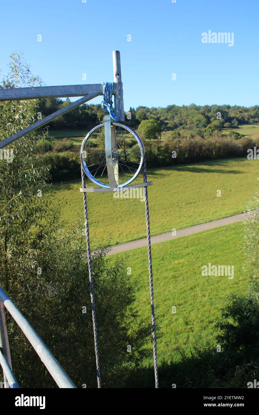 Round pulley with rope for lifting a load on a construction site Stock ...