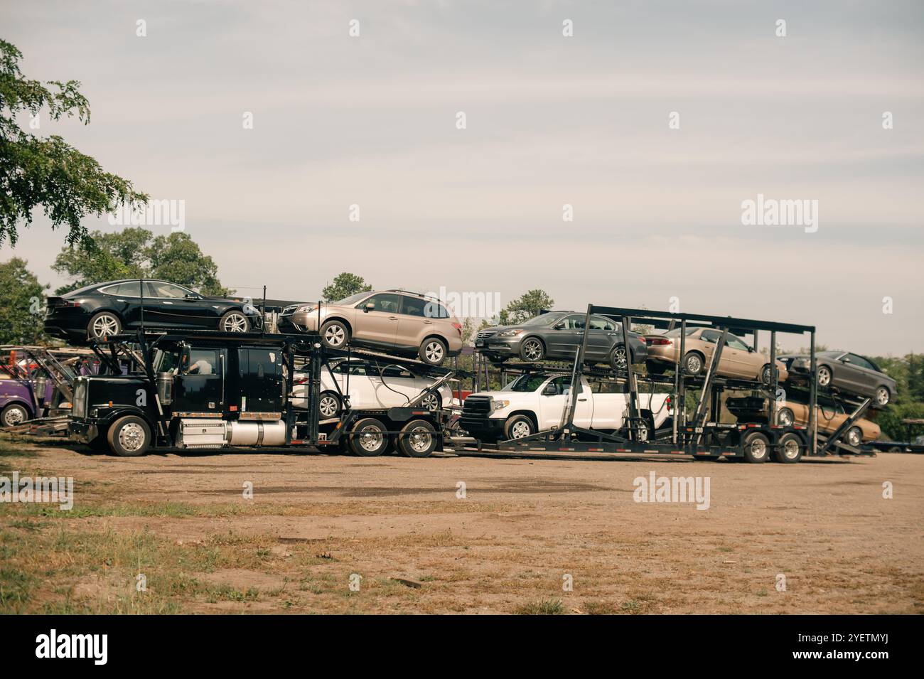 Industrial carrier powered day cab big rig black car hauler semi-truck ...