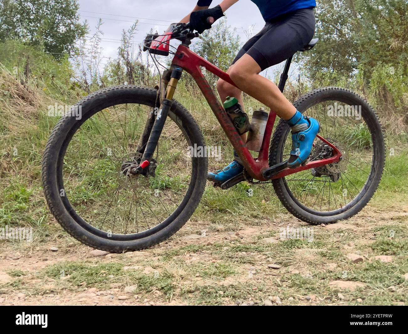 athlete riding mountain bike on trail in cross country race Stock Photo ...