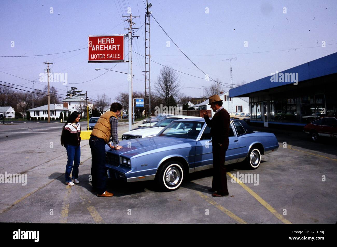 A used car lot with customers and salesman in Lima Ohio in 1983 Photo ...