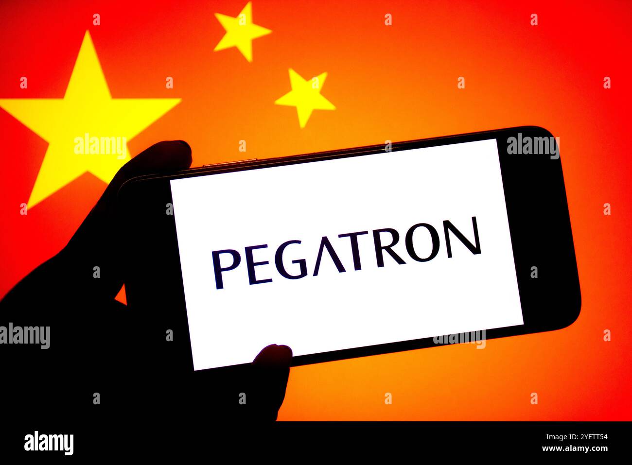 In this photo illustration, a Pegatron logo seen displayed on a smartphone with a Flag of China ...