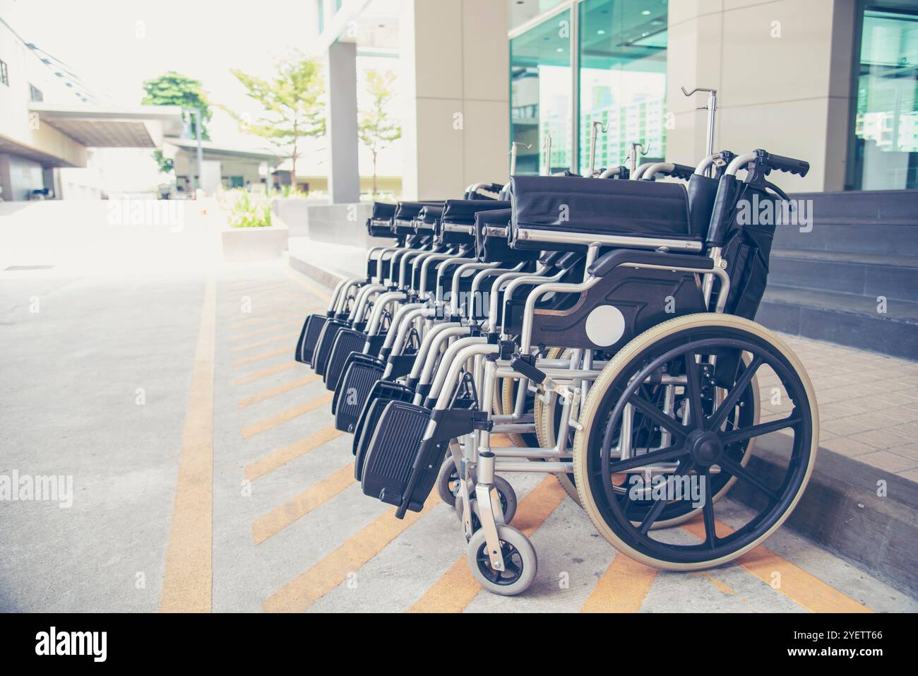 Rows of wheelchairs parking for disability patient services in medical ...