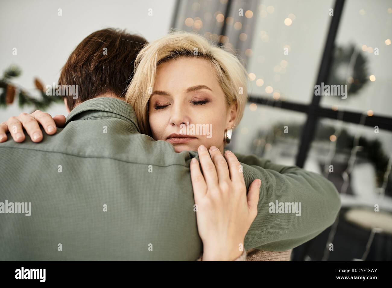 A couple shares a tender embrace, enjoying a quiet moment together in ...