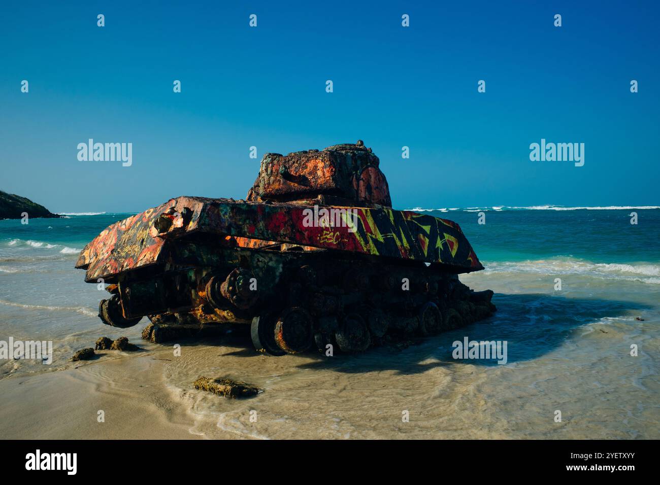 The old rusted and deserted military tank of Flamenco beach on the ...