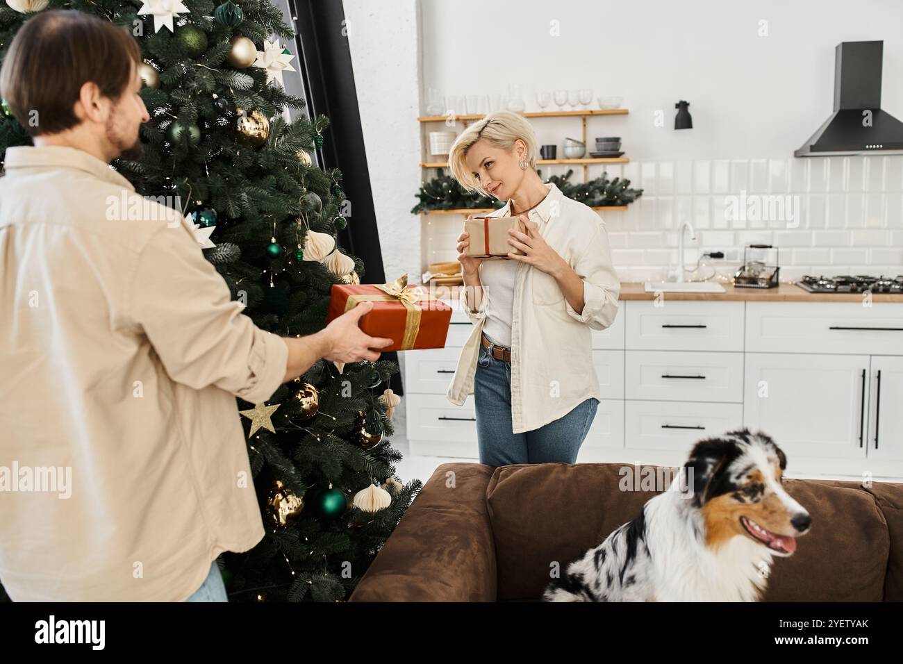 A loving couple shares a tender moment exchanging gifts by a ...