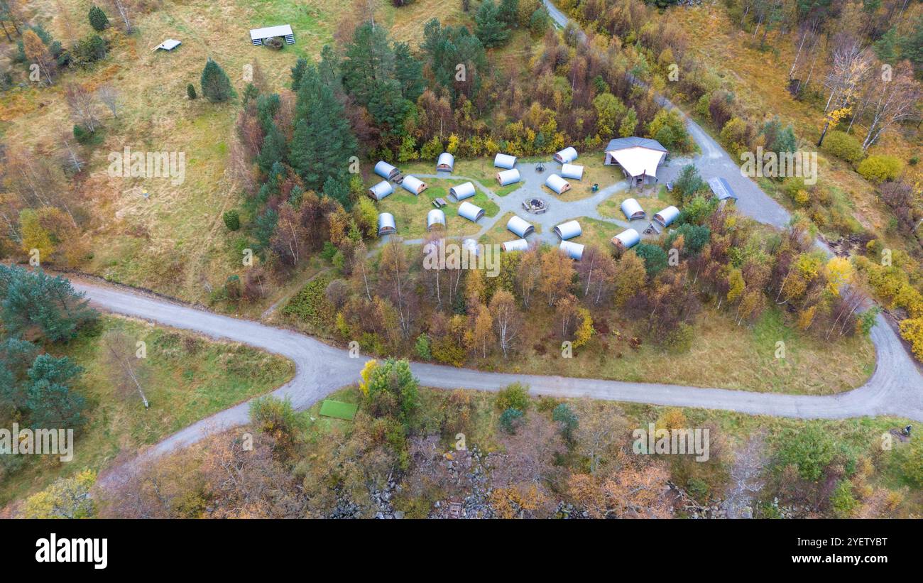 Aerial view of a campsite with multiple tents arranged in a circular ...