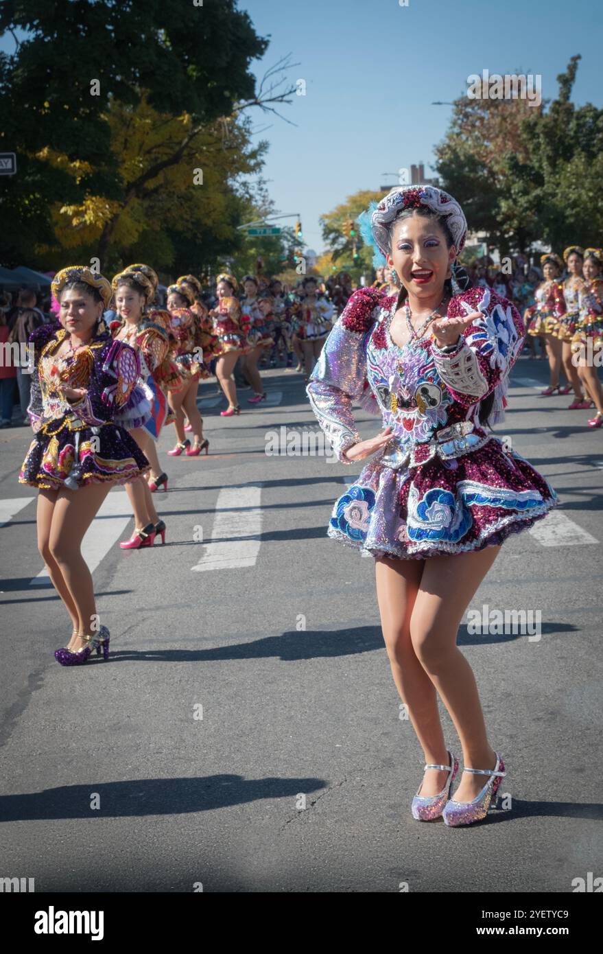 An attractive cheerful San Simon dancer midway through the Bolivian Day ...
