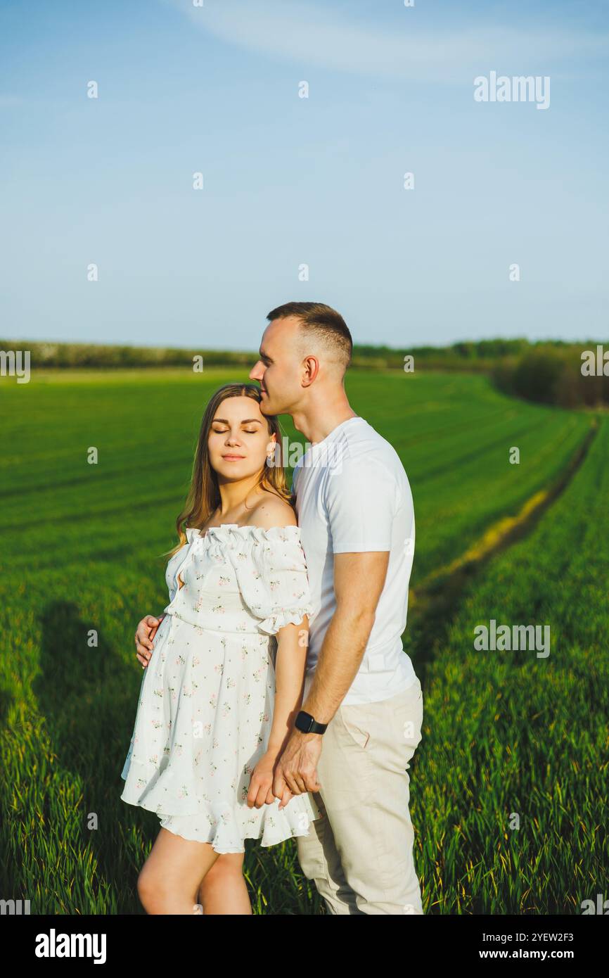 Happy pregnant couple in blossom hi-res stock photography and images ...