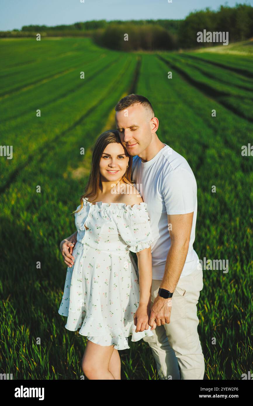 Happy pregnant couple in blossom hi-res stock photography and images ...