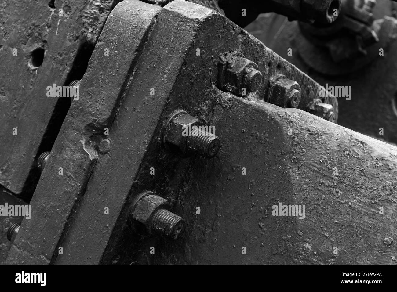 Massive parts of vintage black industrial machine, close up black and ...