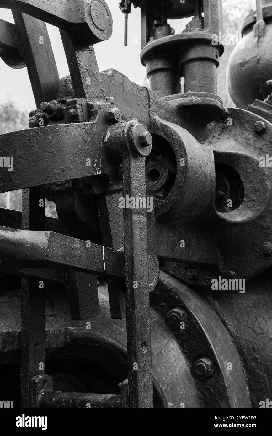 Massive parts of vintage black industrial machine, close up black and ...