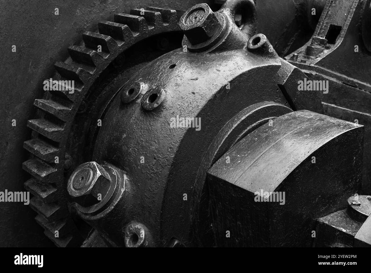 Massive black gears and other parts of vintage industrial machine ...
