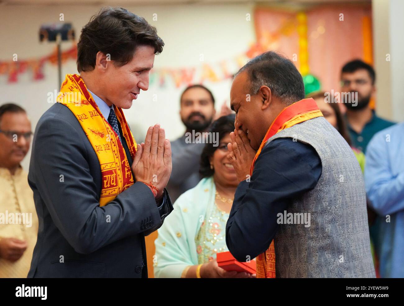 Prime Minister Justin Trudeau, left, attends a Diwali celebration in ...
