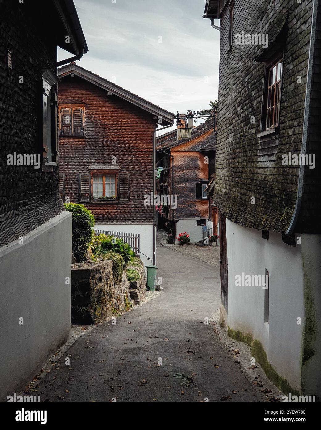 Wooden houses in the old the old town. Narrow street in medieval urban ...
