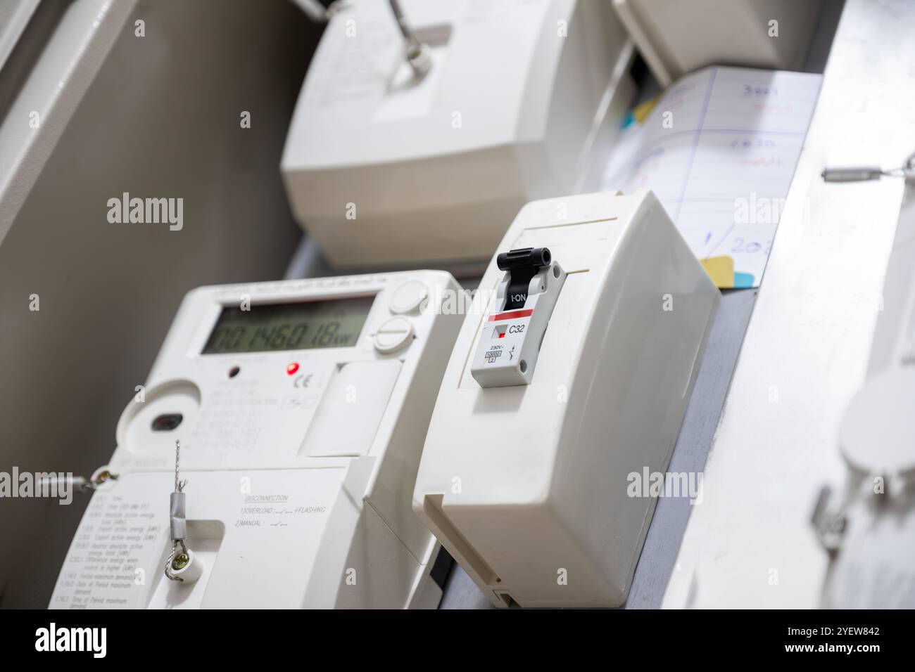 Detailed view of a modern digital electrical meter with switches and ...