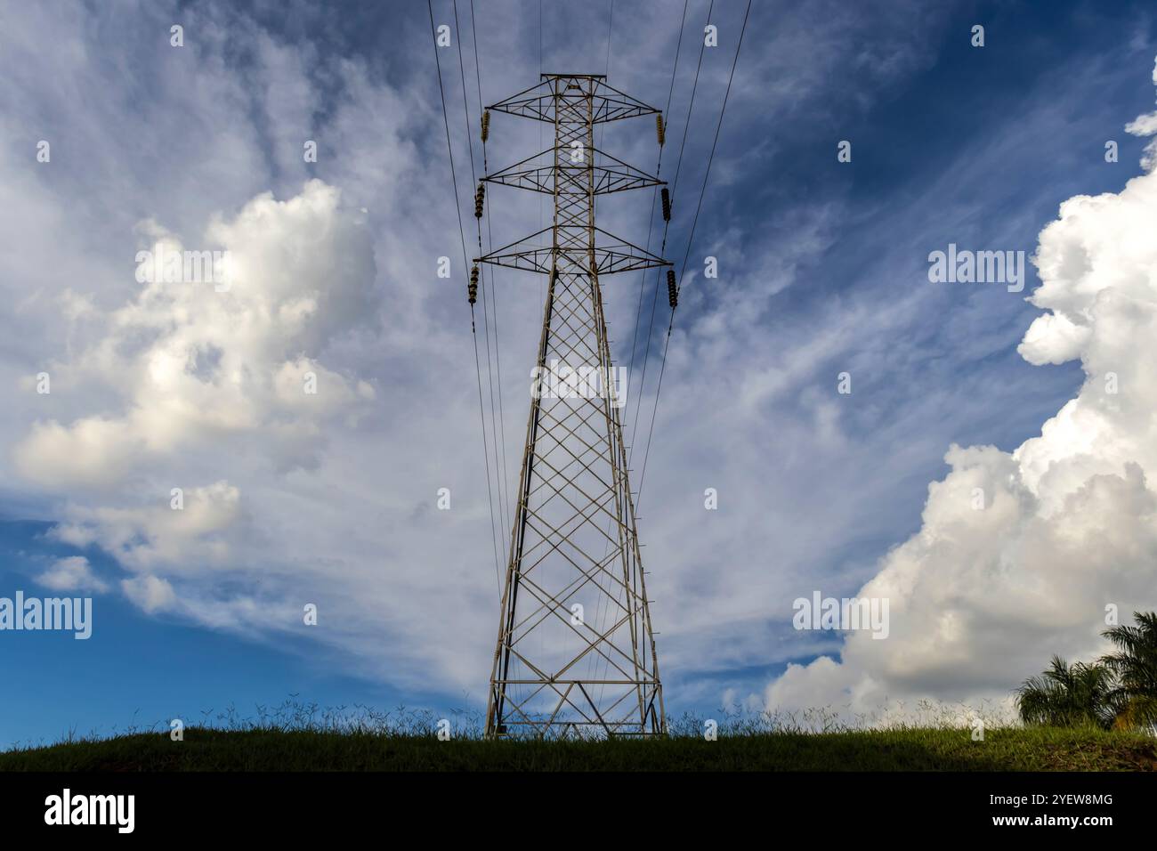 High voltage towers against blue sky background in Brazil Stock Photo ...