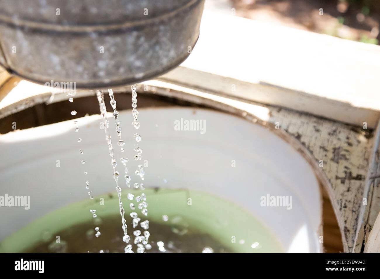 Water dripping into bucket hi-res stock photography and images - Alamy