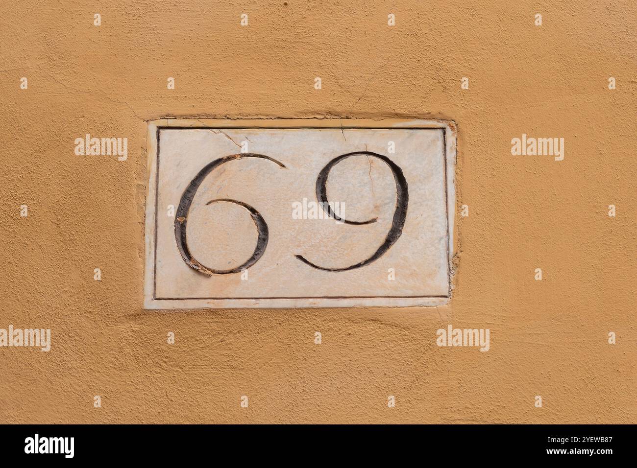 Elegant number sixty nine on doorway number panel Stock Photo - Alamy