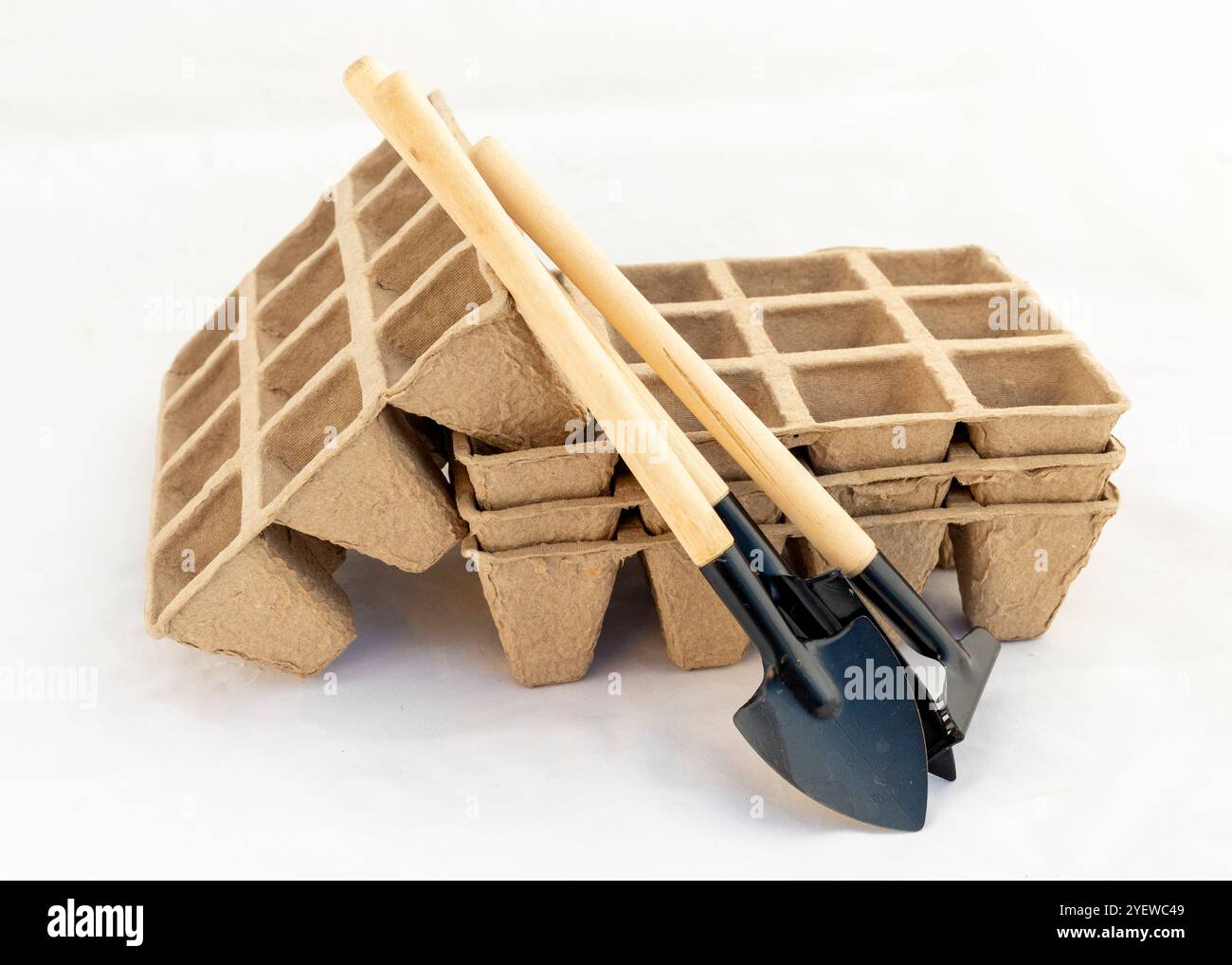 Biodegradable Seed Trays and Gardening Tools on White Background Stock ...