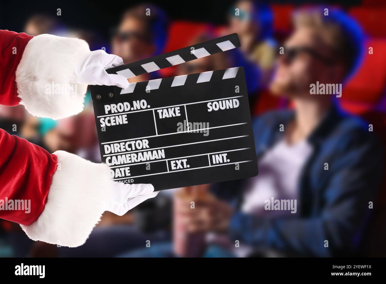 Santa with clapperboard in cinema. Christmas movie concept Stock Photo ...